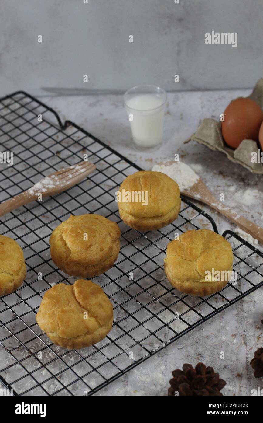 a traditional cake from Indonesia called kue sus filled with cream ...