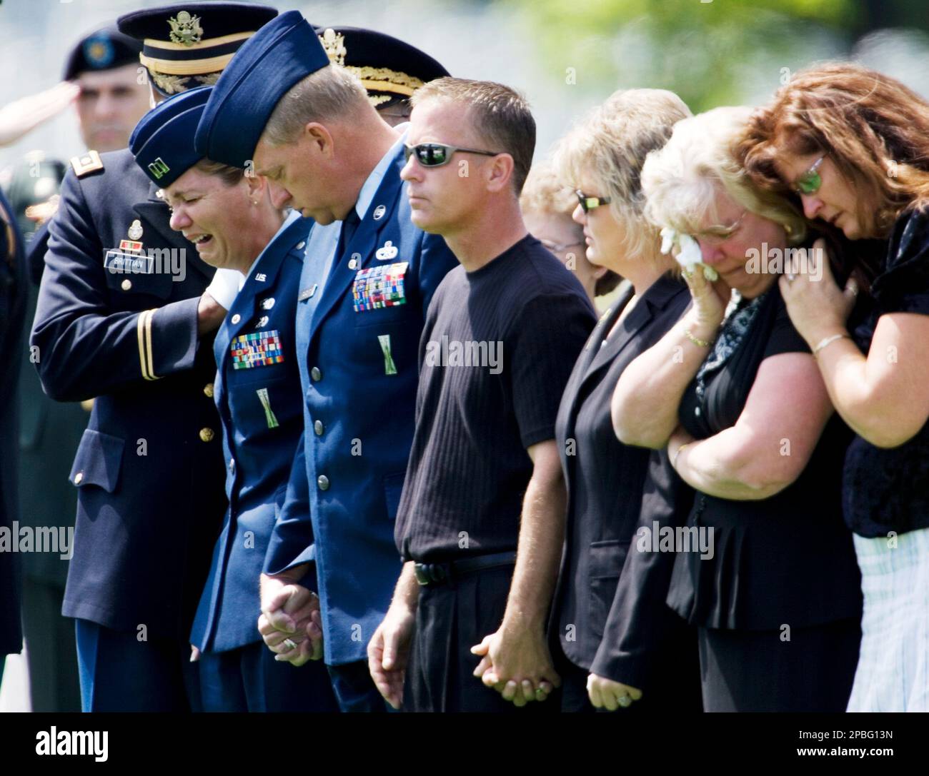 From left, chaplain Maj. Claude Brittian, obscured, Air Force Reserve ...