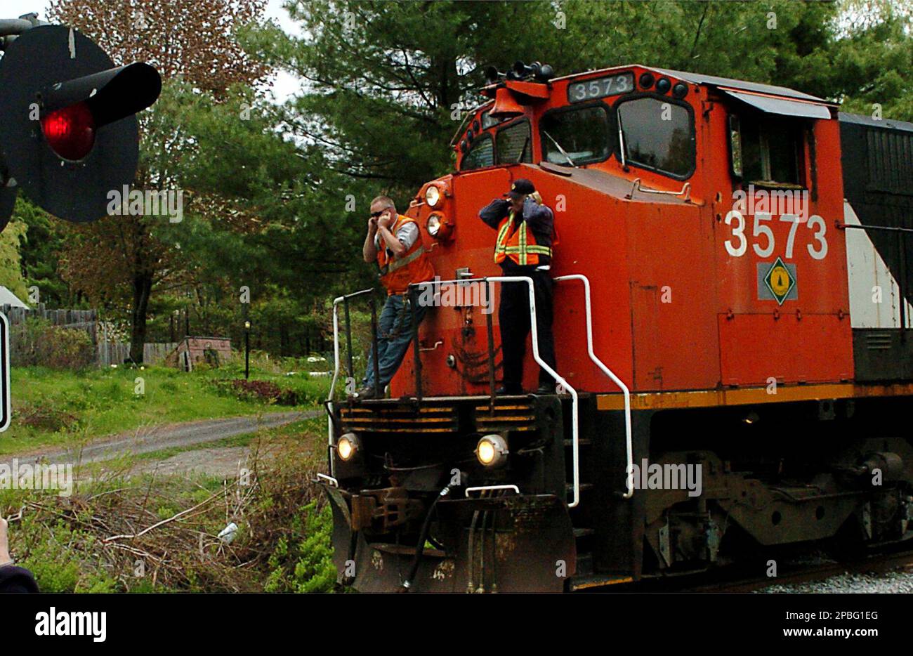 A pair of flaggers aboard the Maine Eastern Railroad's chartered train ...
