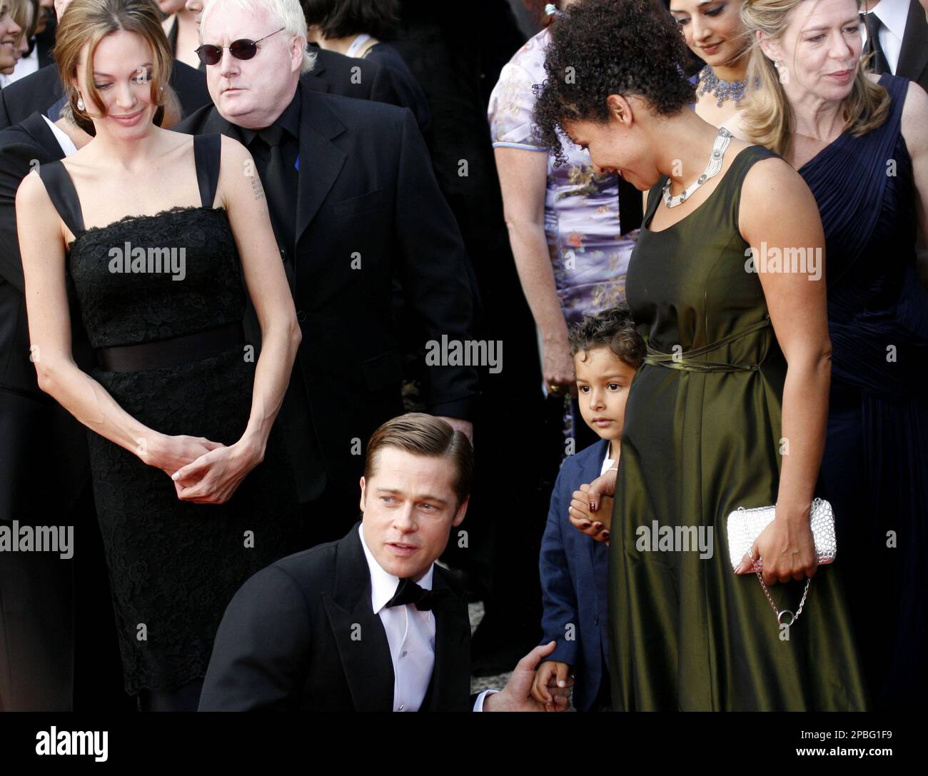 American actor-producer Brad Pitt, center, bends down to speak with ...