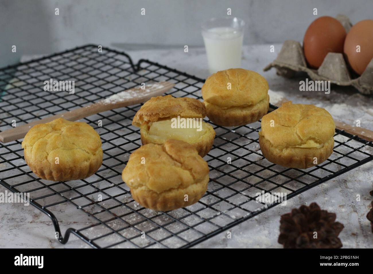 a traditional cake from Indonesia called kue sus filled with cream ...