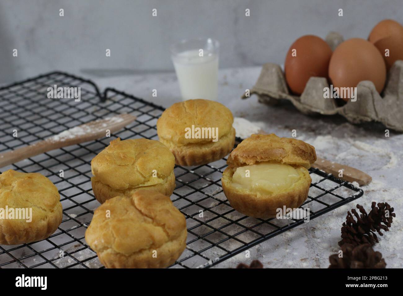 a traditional cake from Indonesia called kue sus filled with cream ...