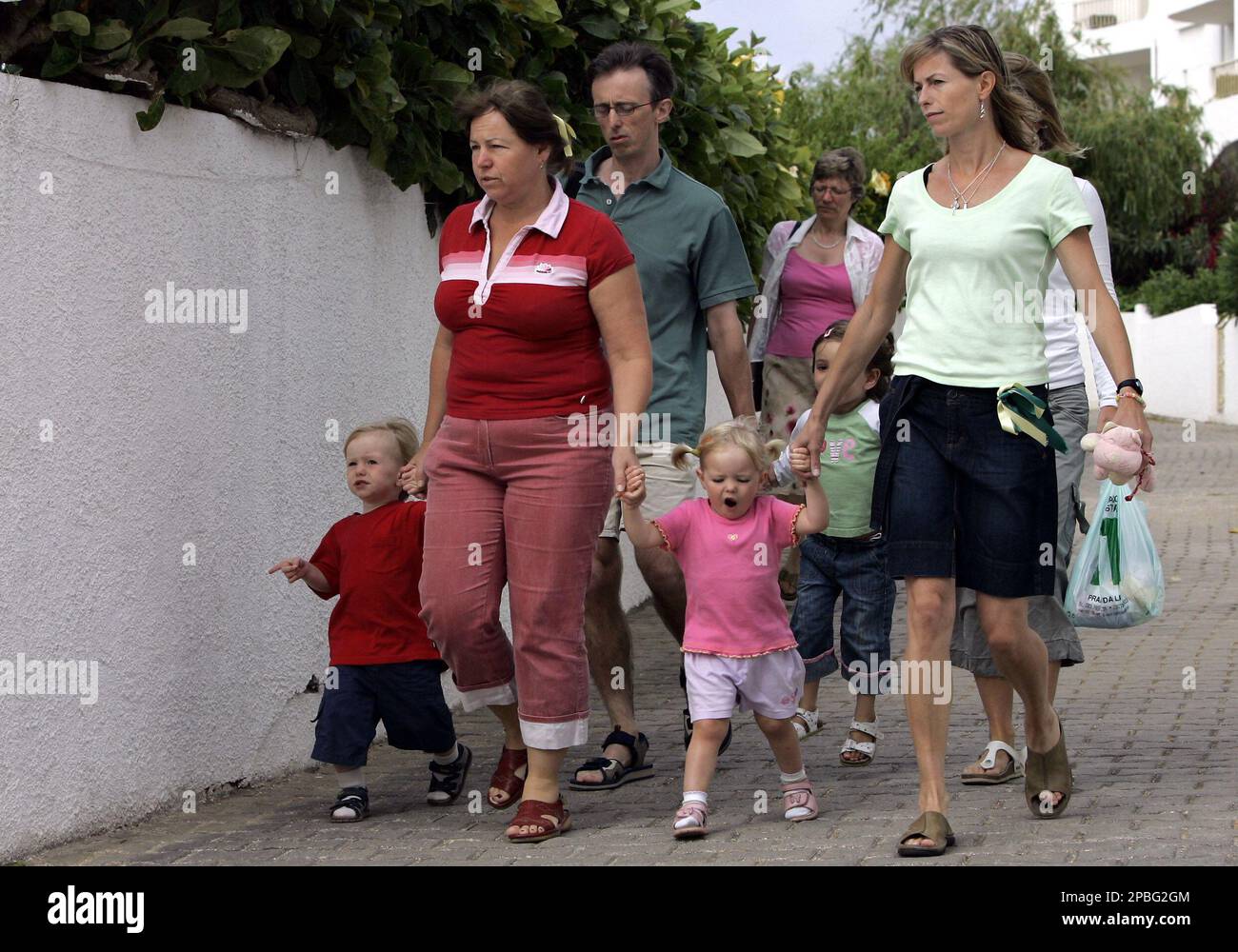 Kate McCann, right, the mother of missing girl Madeleine McCann, holds ...
