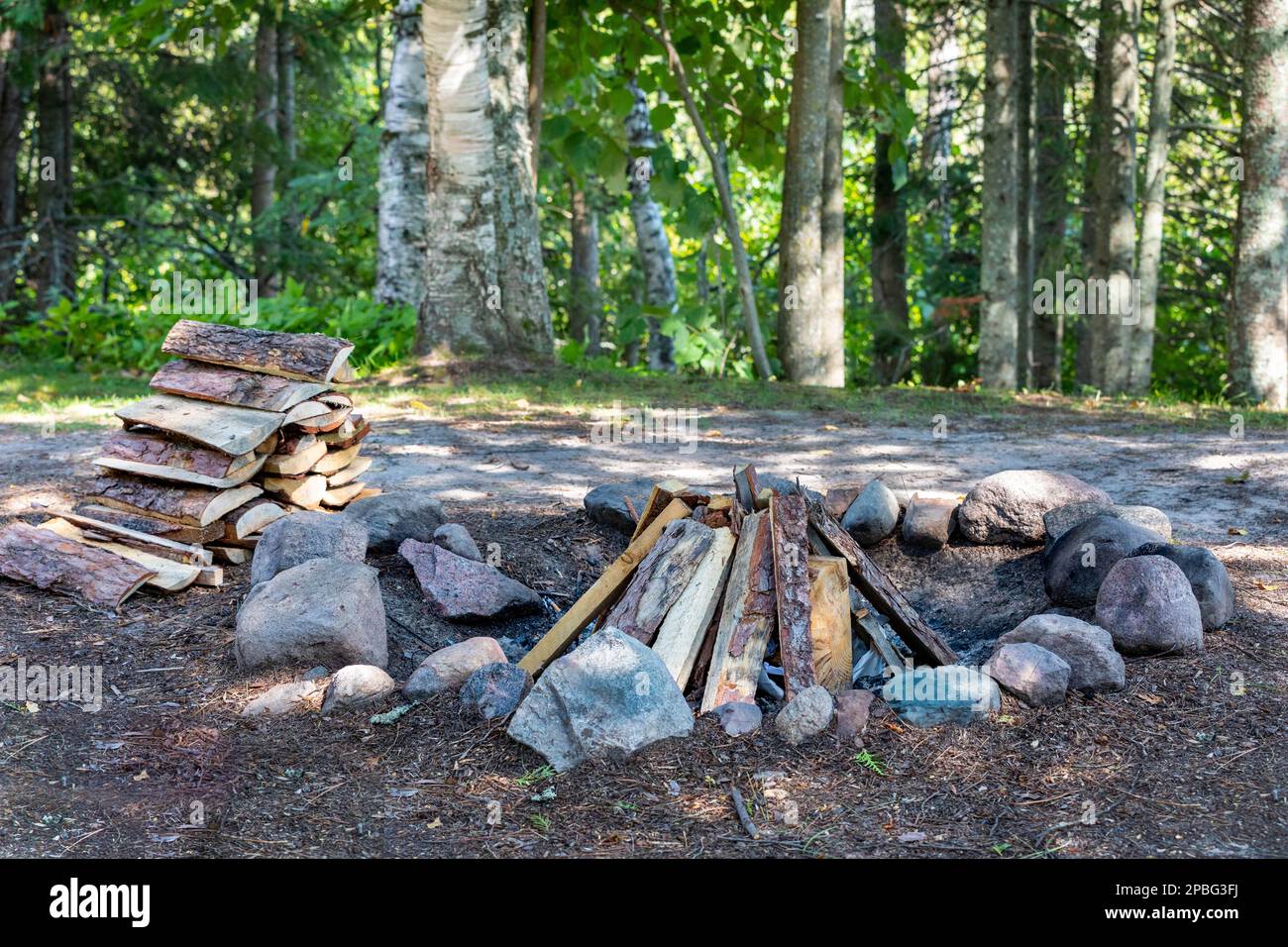 Campfire ring in wilderness campsite Stock Photo - Alamy