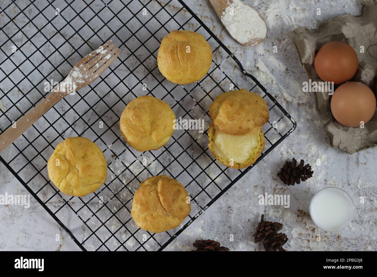 a traditional cake from Indonesia called kue sus filled with cream ...