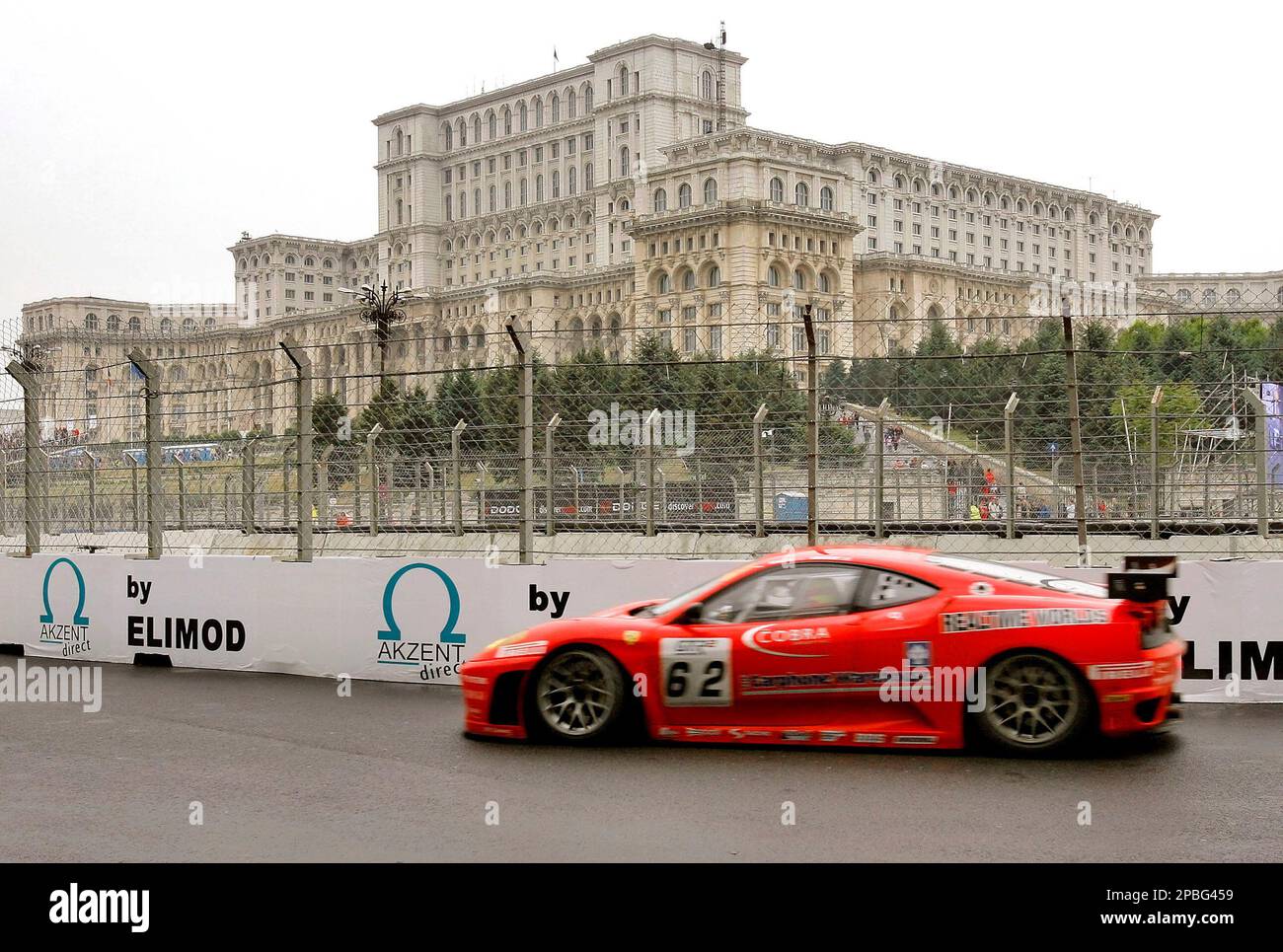 A car speeds on a circuit around the House of the People, background ...