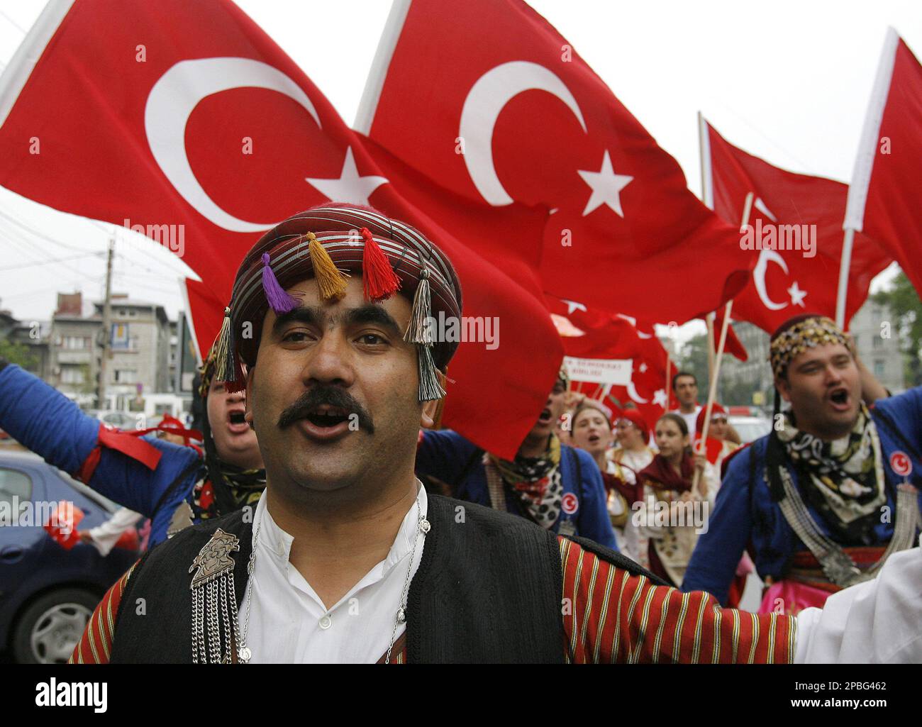 Members of the Turkish community in Romanian march wearing traditional ...