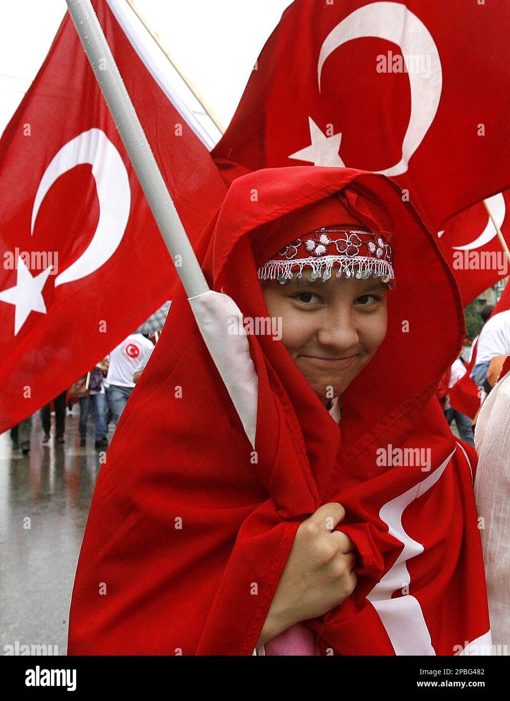 A child of the Turkish community in Romanian marches wearing ...
