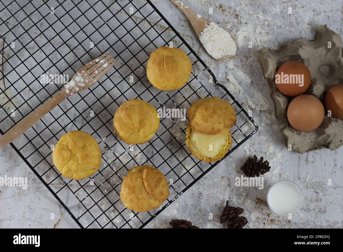 a traditional cake from Indonesia called kue sus filled with cream ...