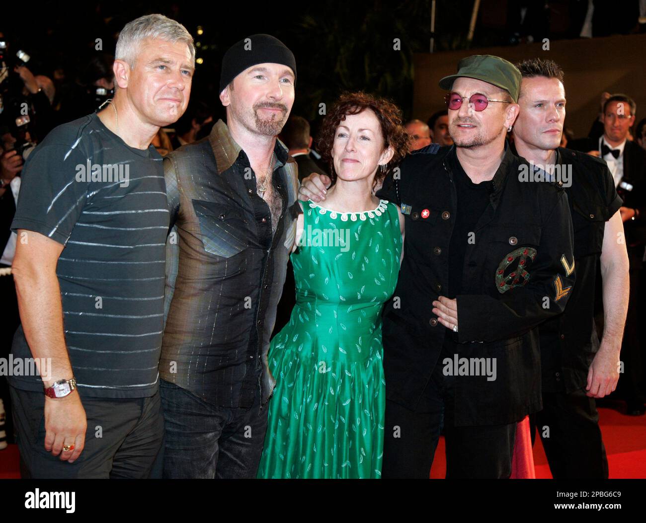 The members of U2, from left, Adam Clayton, The Edge, director ...