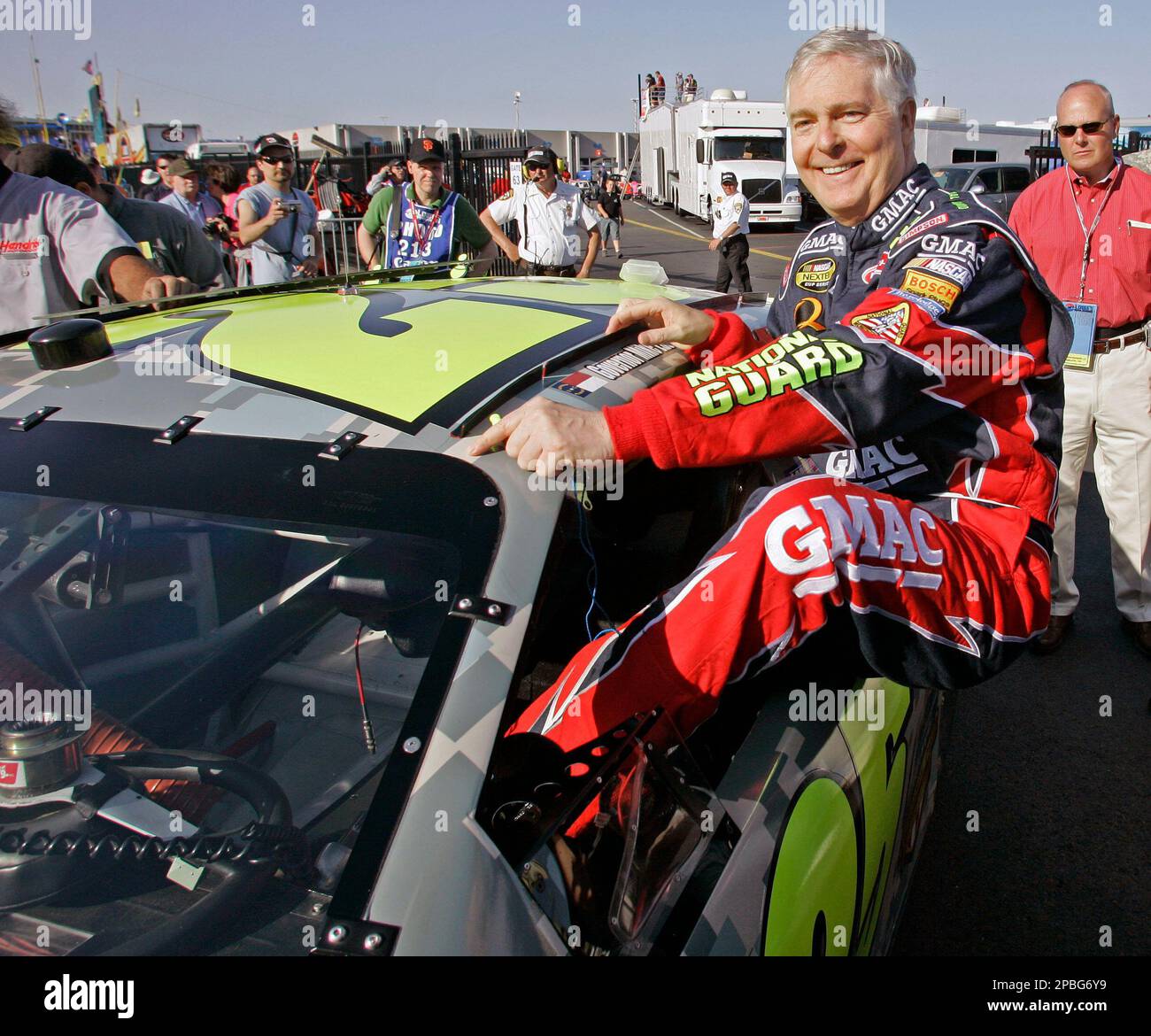 North Carolina Gov. Mike Easley climbs into a race car to drive laps ...