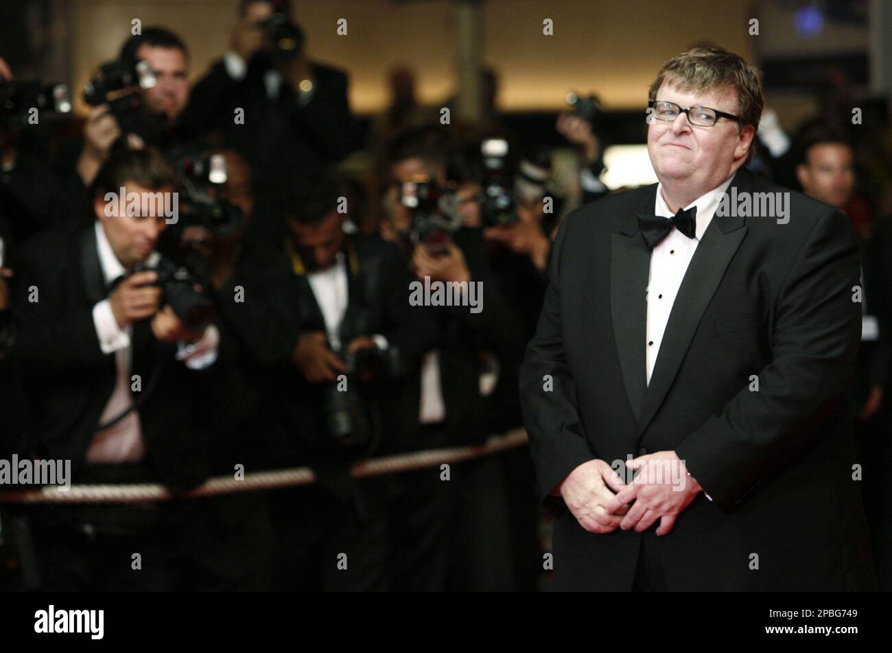 American director Michael Moore arrives for the screening of the film ...