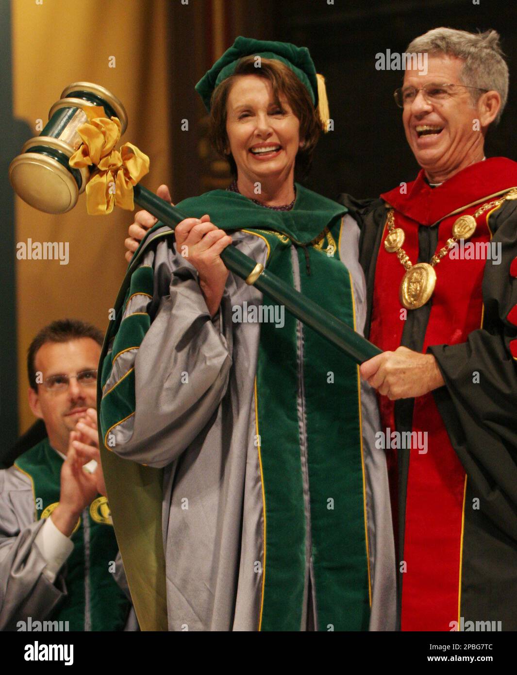 House Speaker Nancy Pelosi, left, is presented with a large gavel by ...