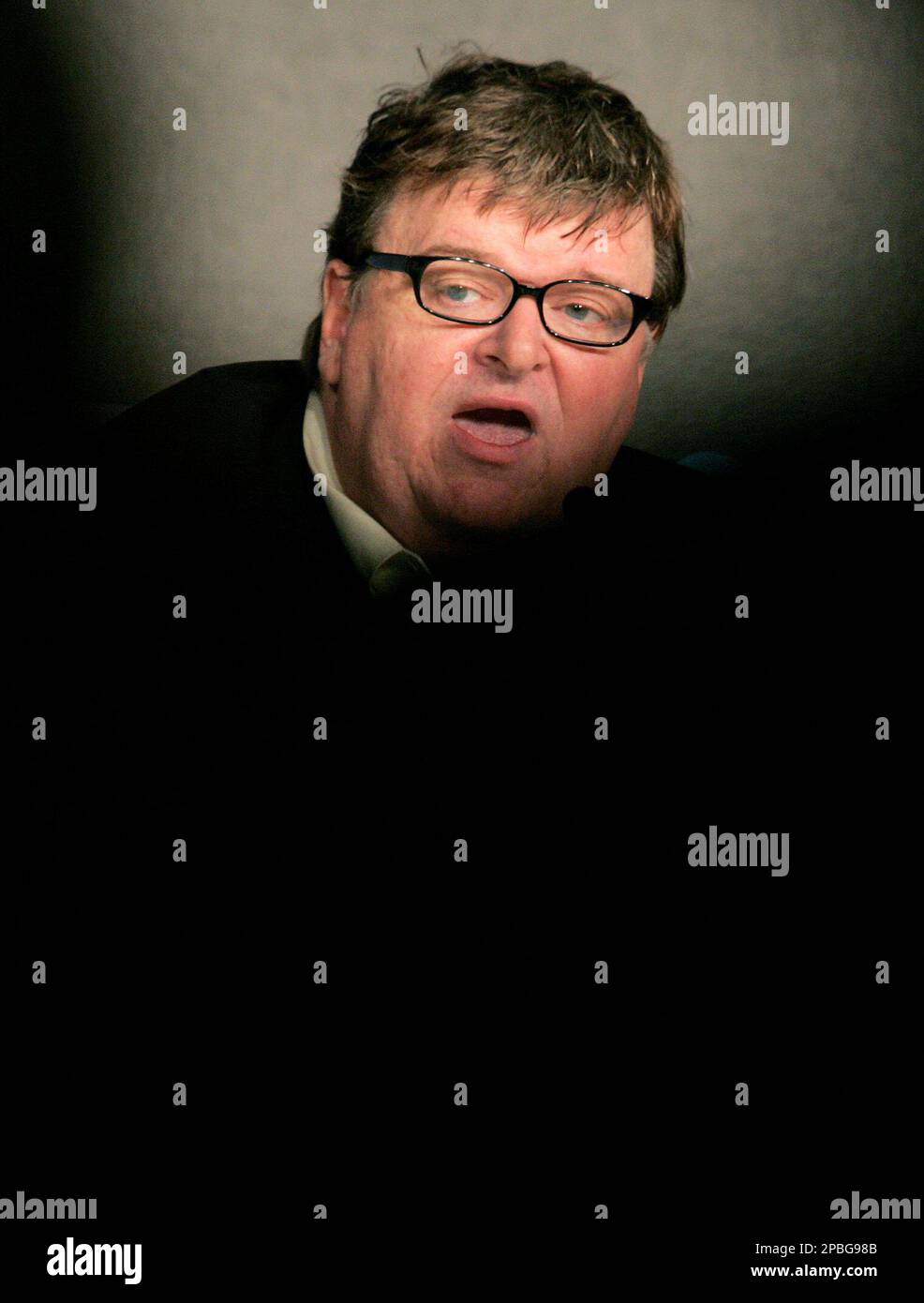 American director Michael Moore speaks at a press conference for the ...