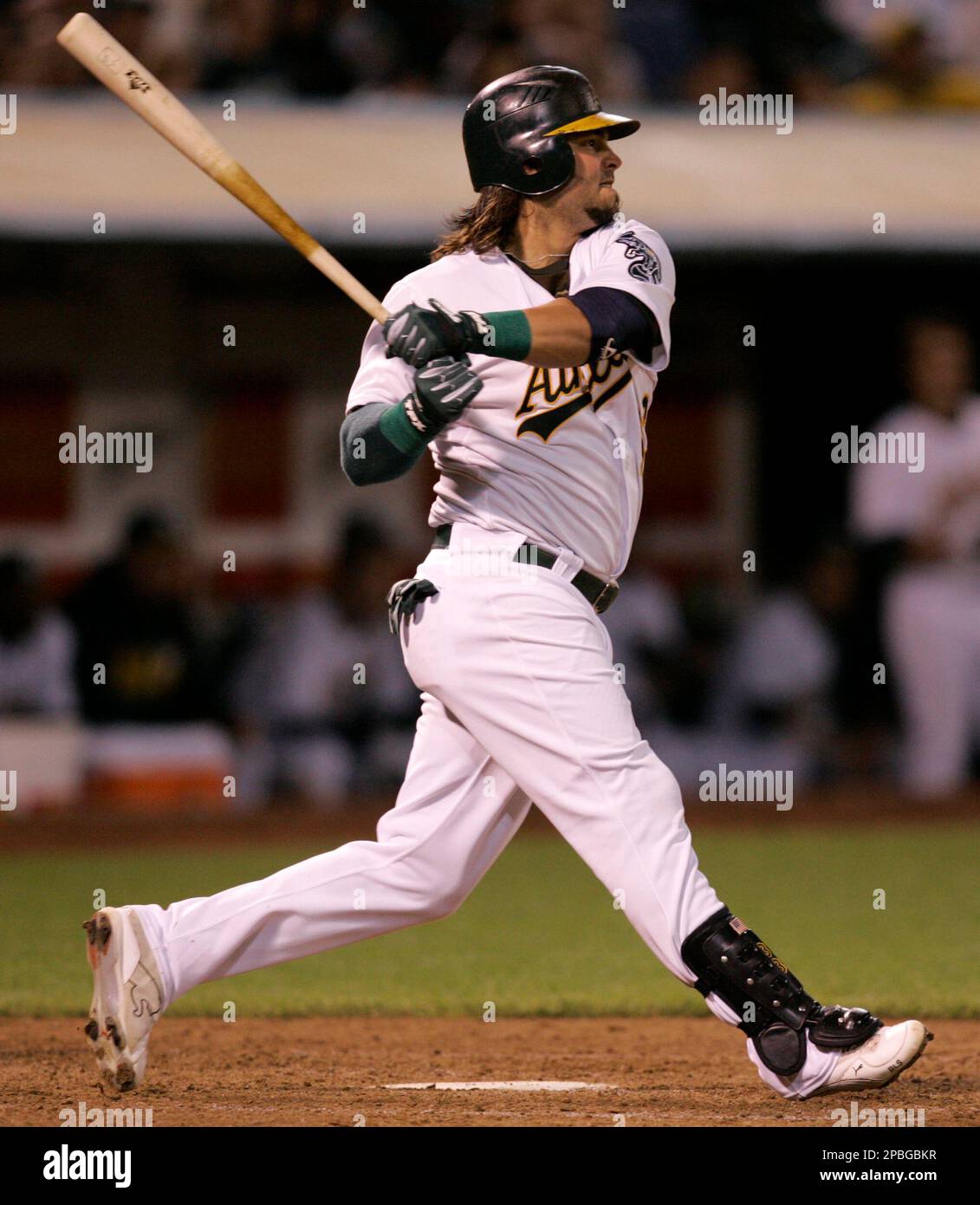 Oakland Athletics' Nick Swisher swings for a two-RBI double off San ...