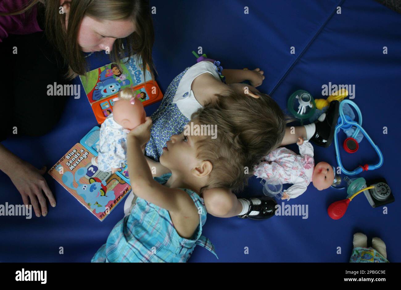 Conjoined twins Tatiana and Anastasia Dogaru work with Child Life ...