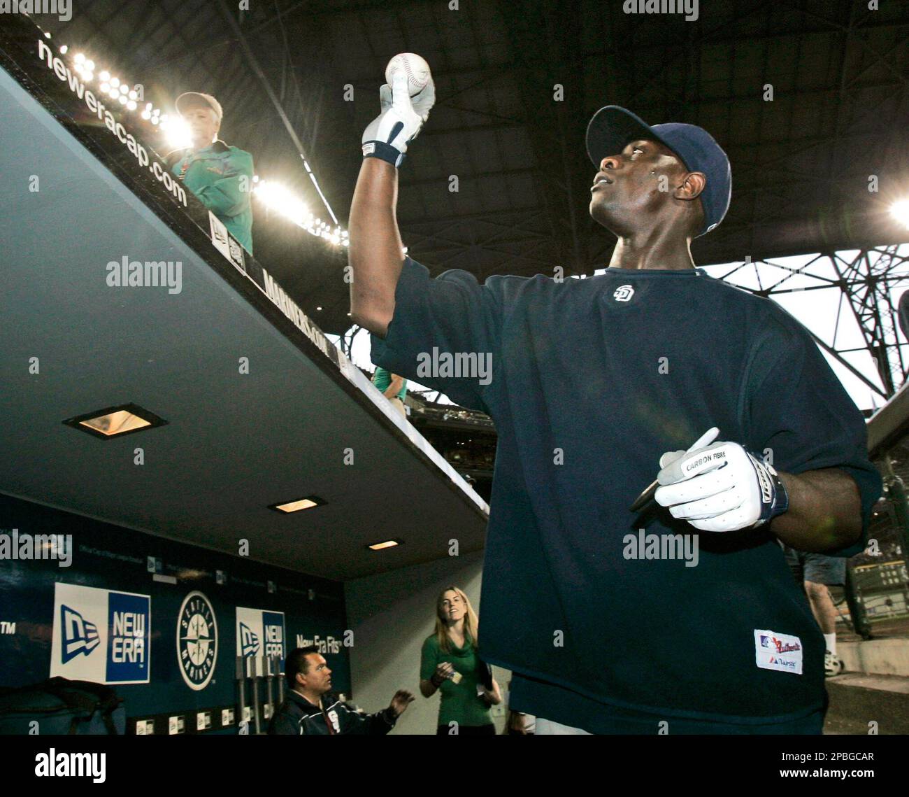 San Diego Padres outfielder Mike Cameron signs autographs Friday, May ...