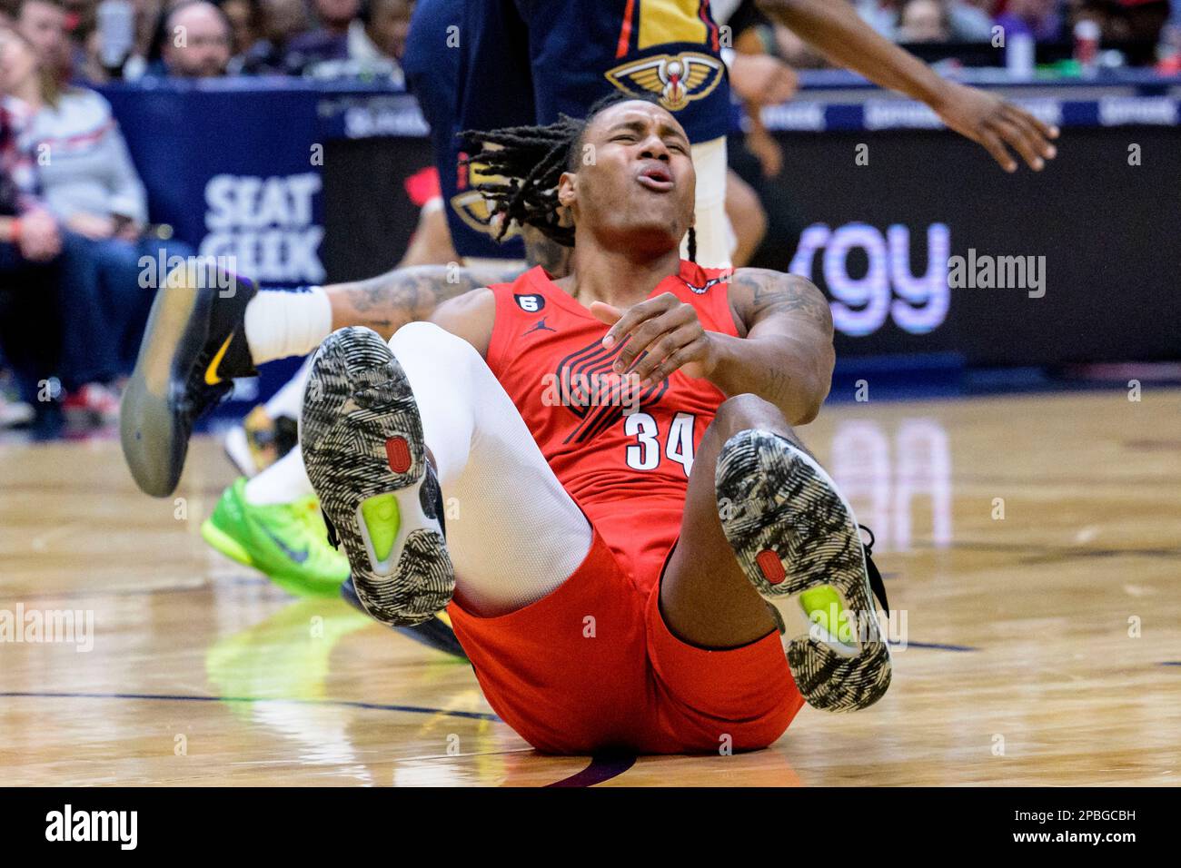 Portland Trail Blazers forward Jabari Walker (34) reacts after falling ...