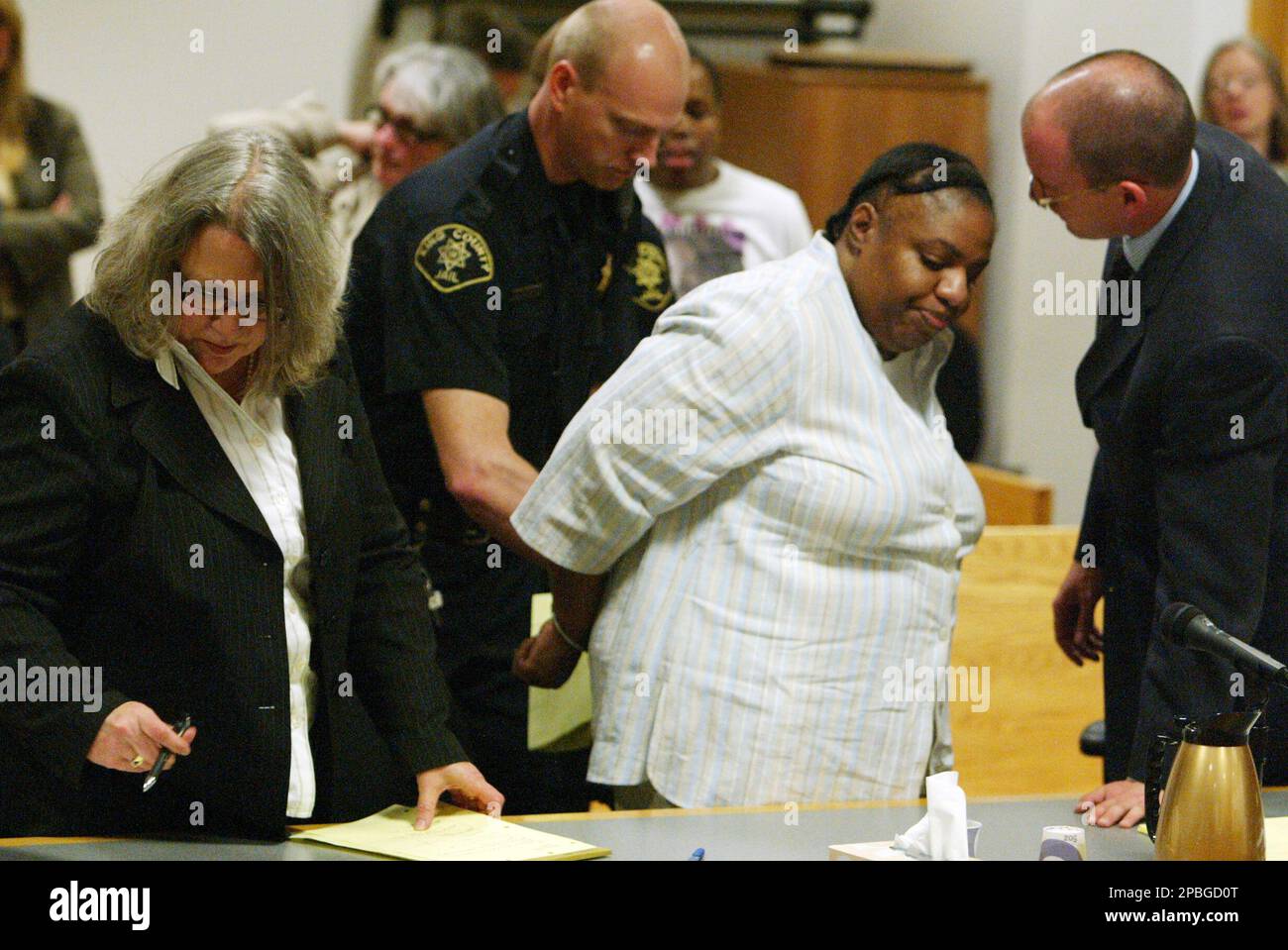 Samara Spann is handcuffed after her sentencing at the King County Courthouse in Seattle, on ...