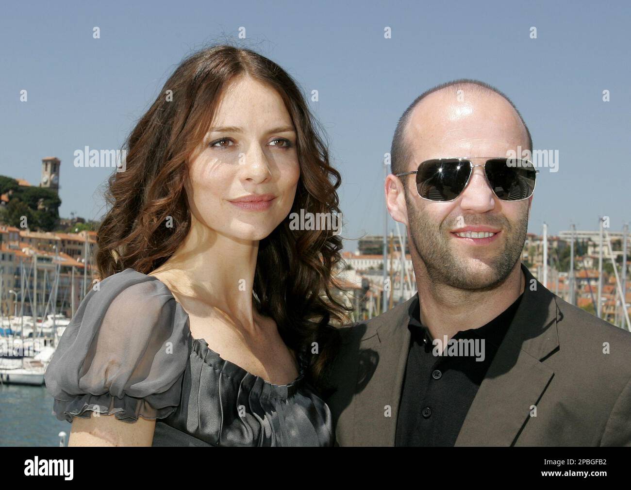 British actors Saffron Burrows, left, and Jason Statham pose during a ...