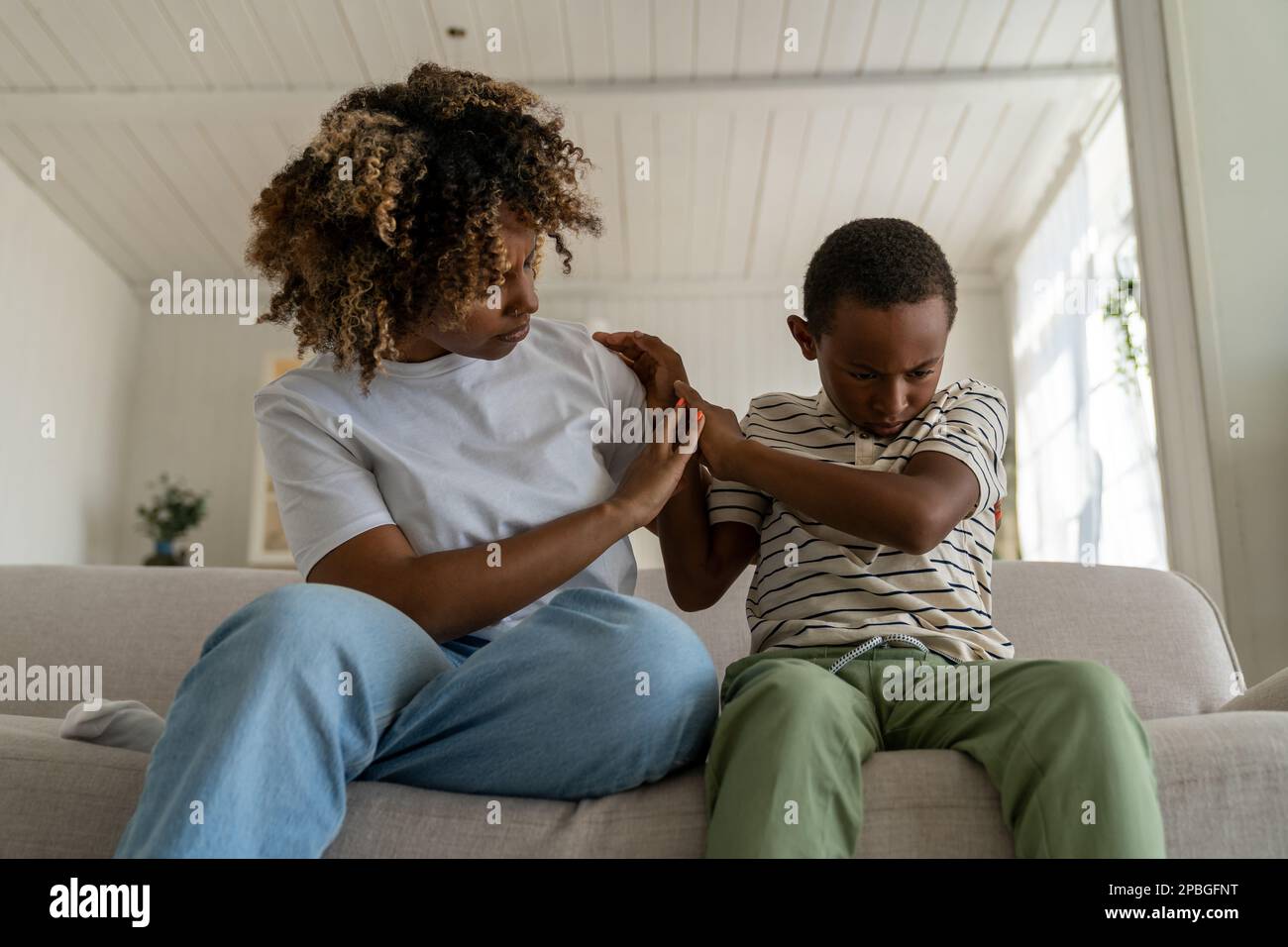 Angry offended child african american boy ignoring adoptive mother at ...