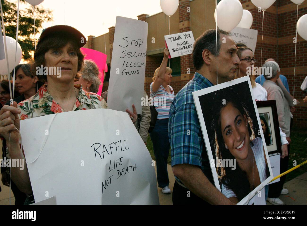 Martha Barnes, of Annandale, Va., left, stands by Joe Samaha, holding a ...