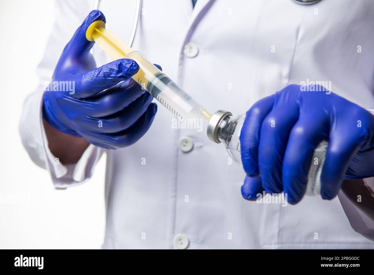 closeup of doctor do vaccination injection in studio. doctor do ...