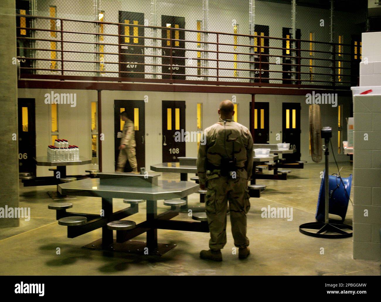 Guards keep watch inside a cell block at Camp 5 maximum security ...