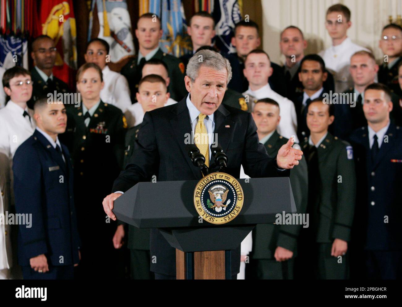 President Bush, center, speaks in the East Room of the White House in ...