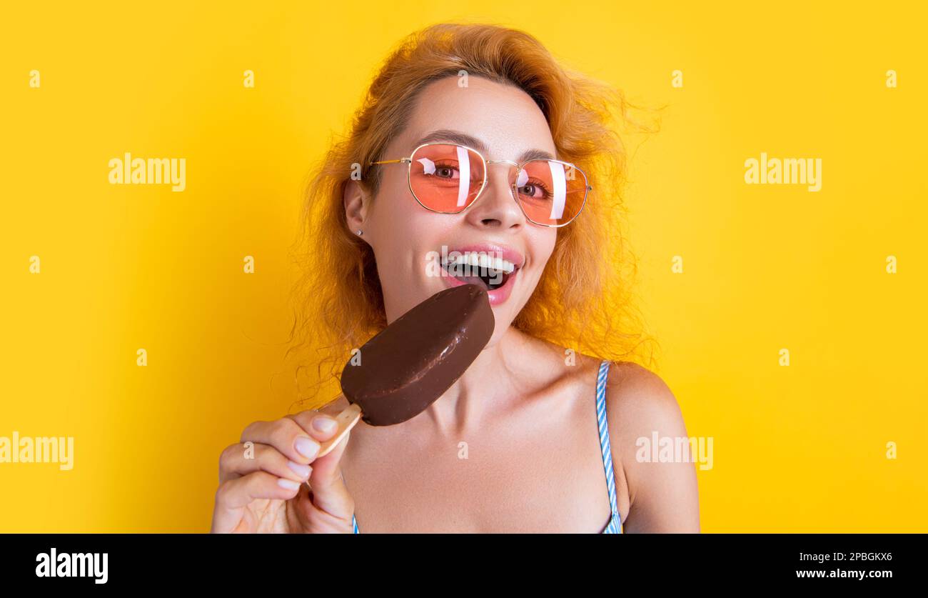 happy face of woman eating icecream in studio. woman with icecream on ...
