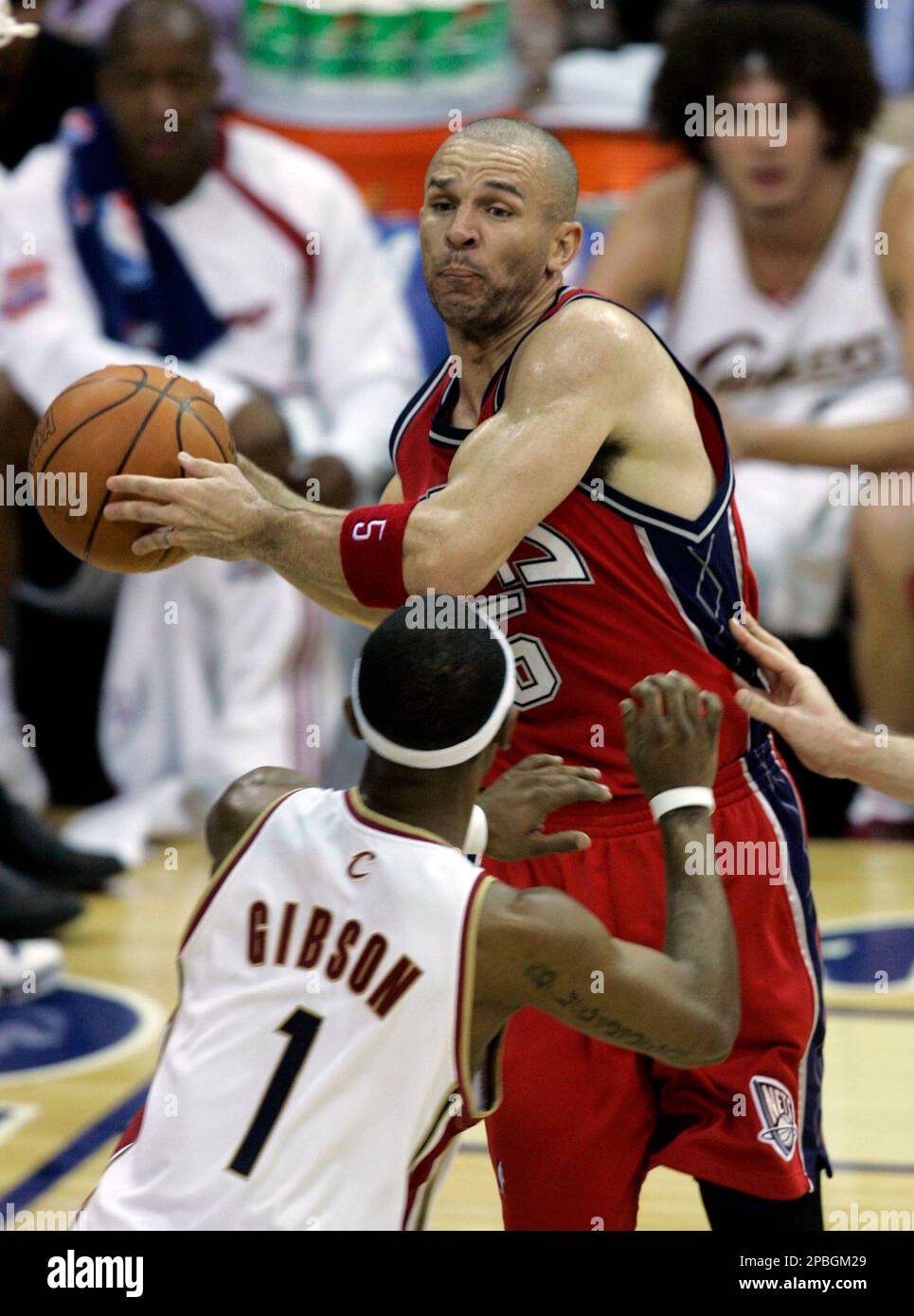 New Jersey Nets' Jason Kidd looks to pass around Cleveland Cavaliers ...
