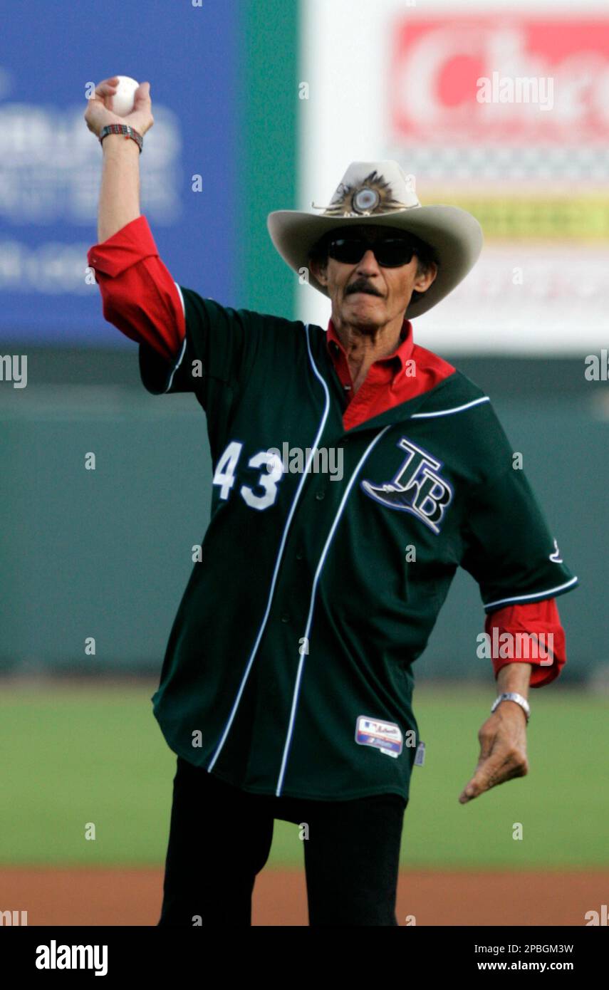 NASCAR great Richard Petty throws the first pitch of a baseball game ...