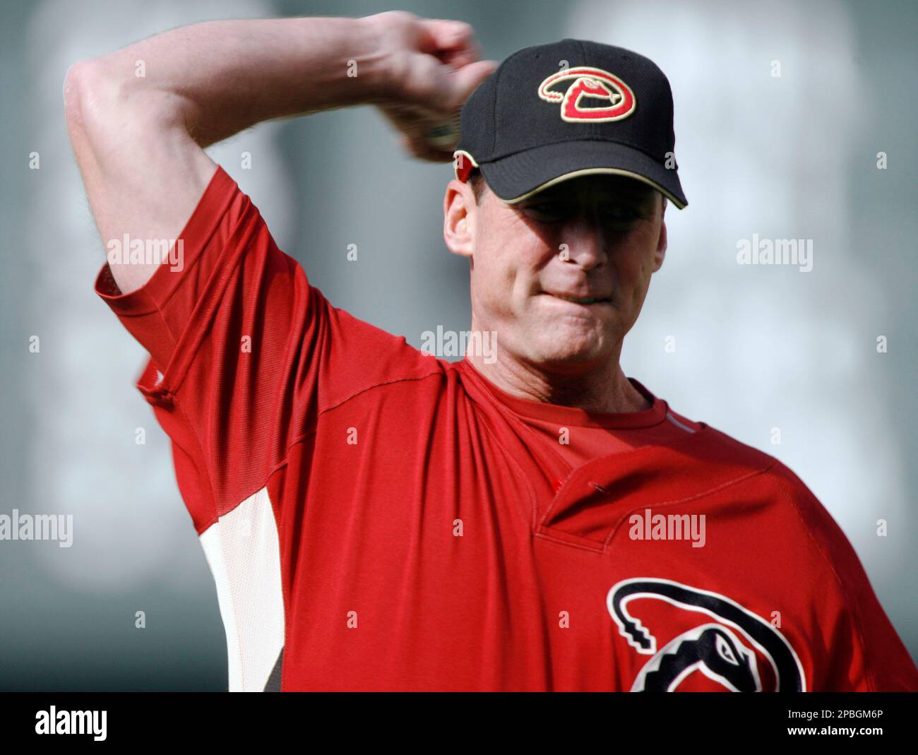 Arizona Diamondbacks manager Bob Melvin pitches during batting practice ...