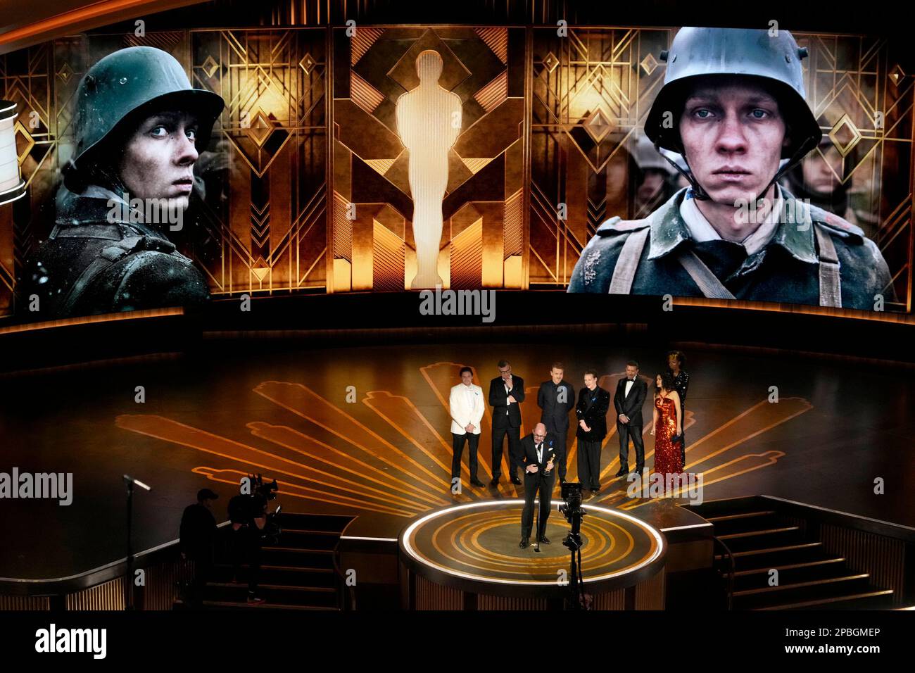 Edward Berger, front center, accepts the award for "All Quiet on the ...