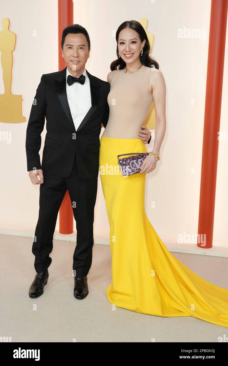 Donnie Yen, left and Cissy Wang arrive at the Oscars on Sunday, March 12, 2023, at the Dolby ...
