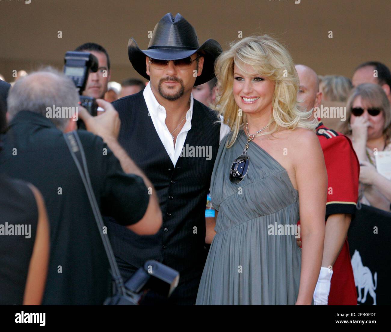 Tim McGraw, left, and his wife Faith Hill arrive at the 42nd Annual ...