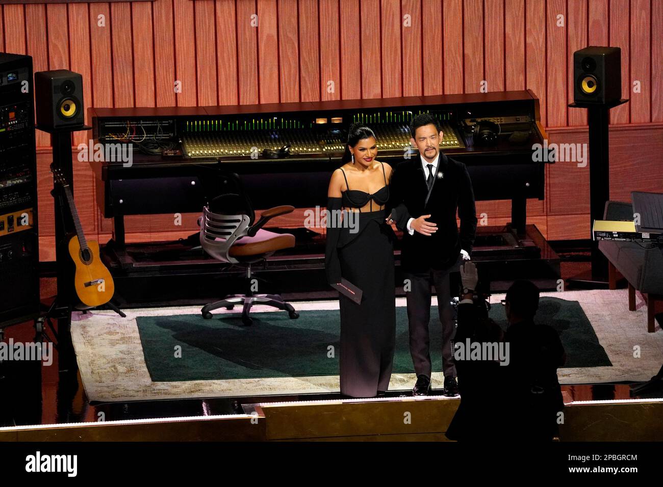 Mindy Kaling, left, and John Cho present the award for best original ...