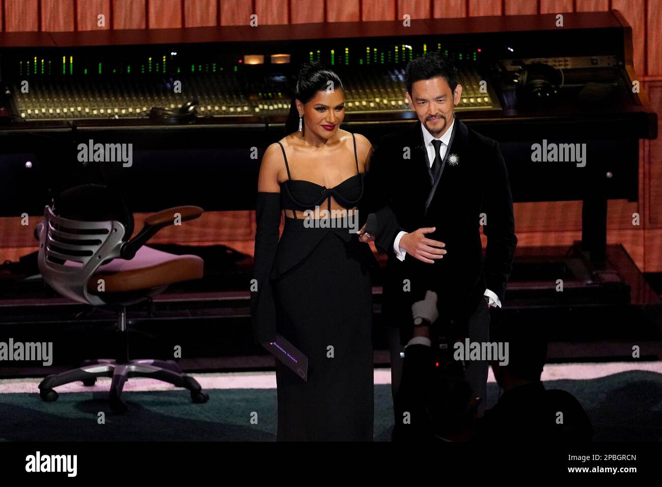 Mindy Kaling, left, and John Cho present the award for best original ...