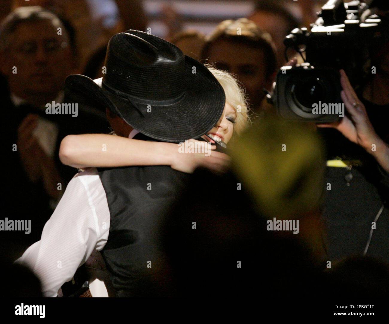Taylor Swift hugs Tim McGraw after performing her song "Tim McGraw ...