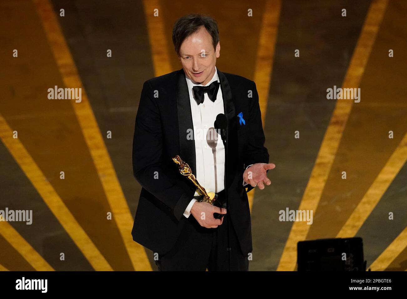 Volker Bertelmann accepts the award for best original score for "All ...