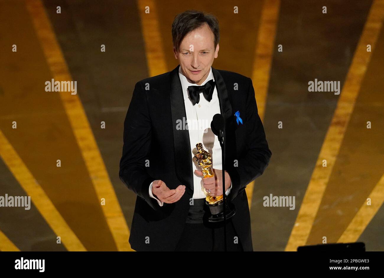 Volker Bertelmann accepts the award for best original score for "All ...