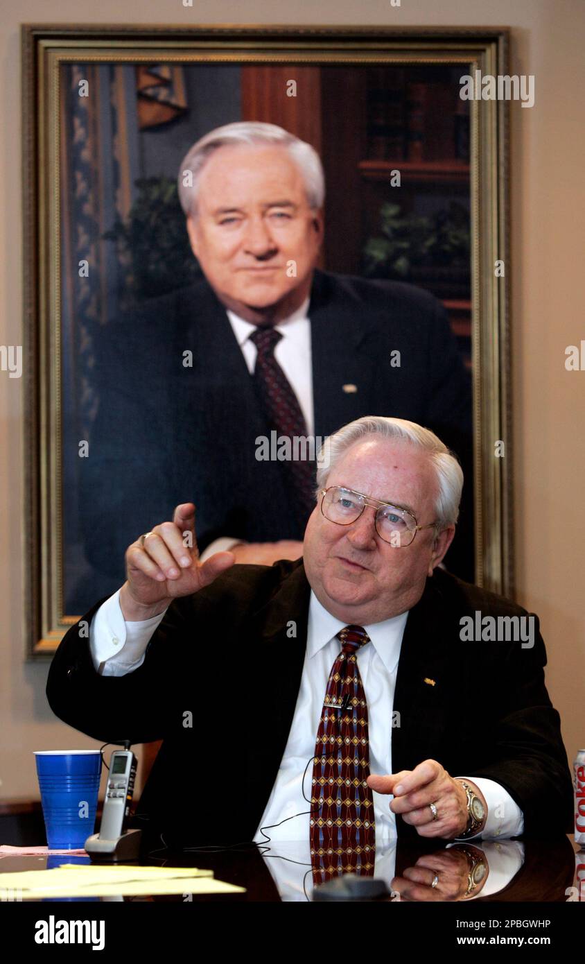 **FILE** Rev. Jerry Falwell gestures in front of a portrait of himself ...