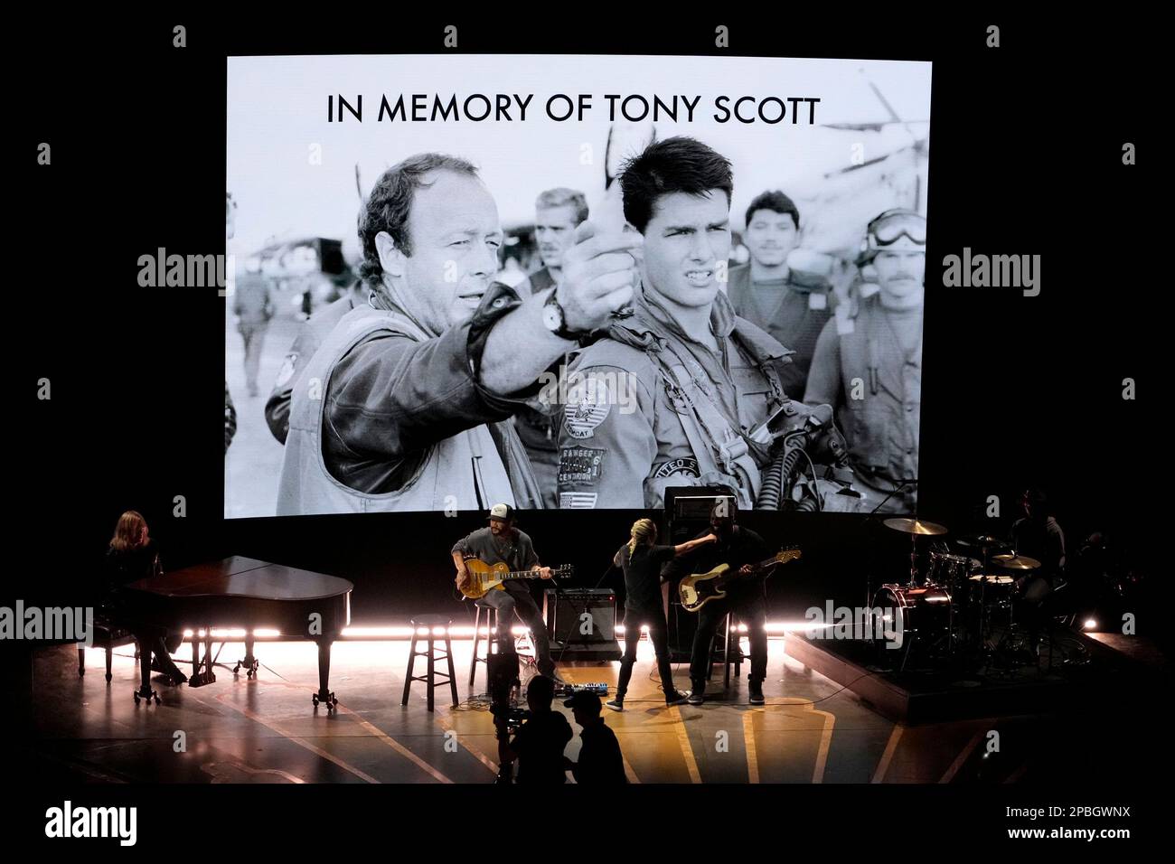 A screen depicting "In Memory of Tony Scott" is seen as Lady Gaga ...