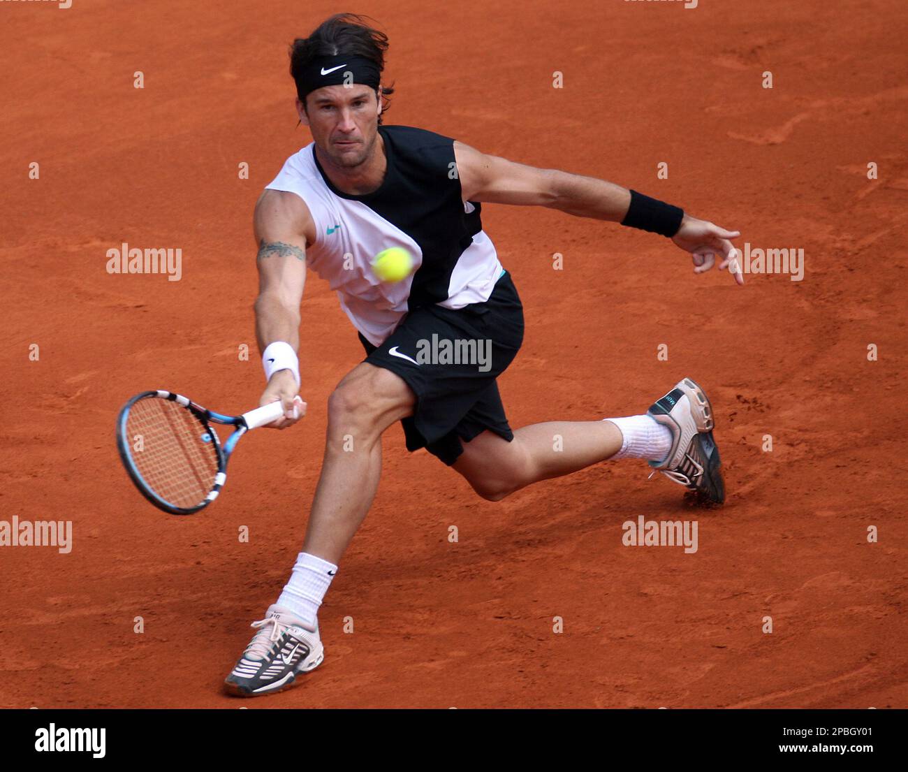 Spain's Carlos Moya returns a ball during his first round match against ...