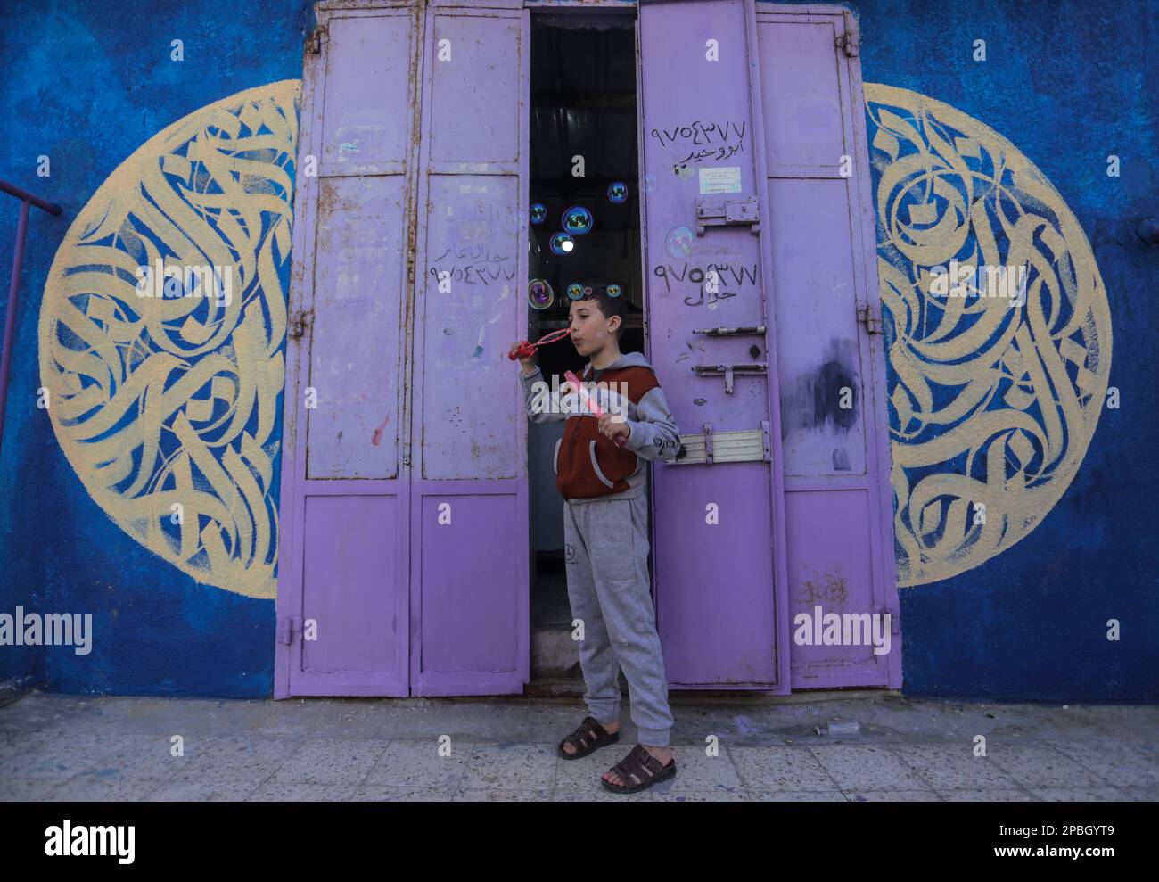 March 12, 2023, Gaza City, The Gaza Strip, Palestine: A child blows a ...