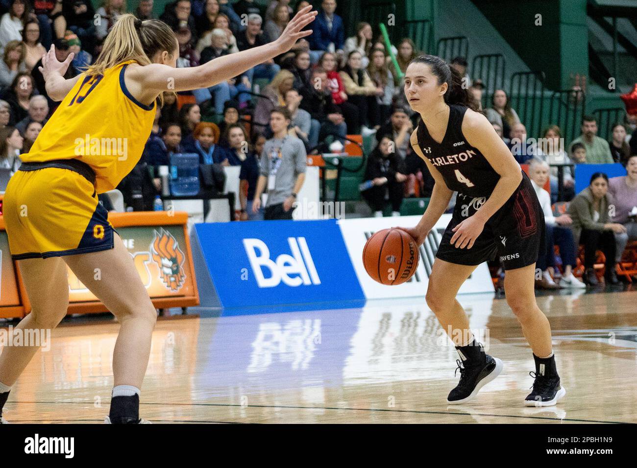 Carleton Ravens' Kali Pocrnic (4) looks to move the ball against the ...