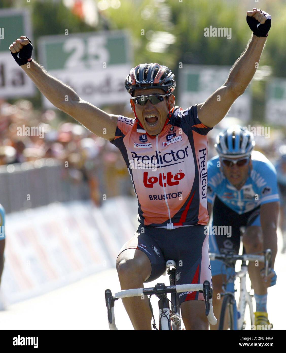 Robbie Mc Ewen, of Australia, celebrates as he crosses the finish line ...