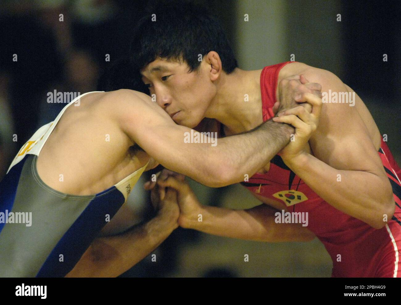 South Korea's Moon Ho-seon, right, and Iran's Hamid Bavafa wrestle during the 60-kilogram men's ...