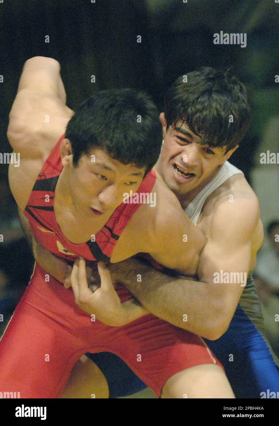 South Korea's Moon Ho-seon, left, and Iran's Hamid Bavafa wrestle during the 60-kilogram men's ...