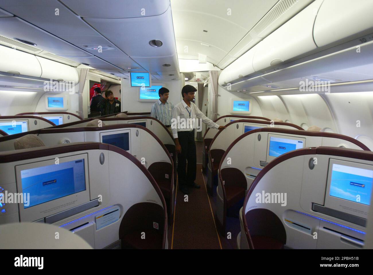 Media persons look at the interiors of Jet Airways newly acquired plane ...
